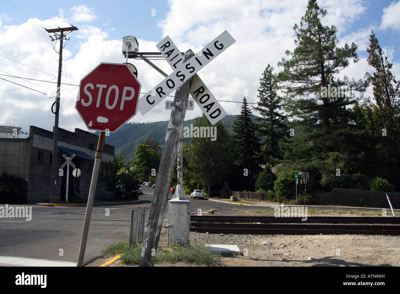 Railroad crossing and Stop signs Stock Photo - Alamy