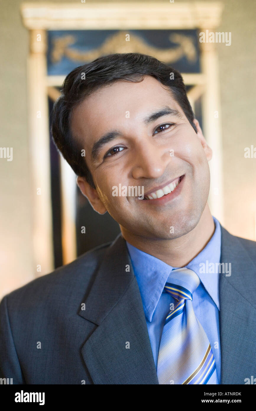 Portrait of a businessman smiling Stock Photo - Alamy