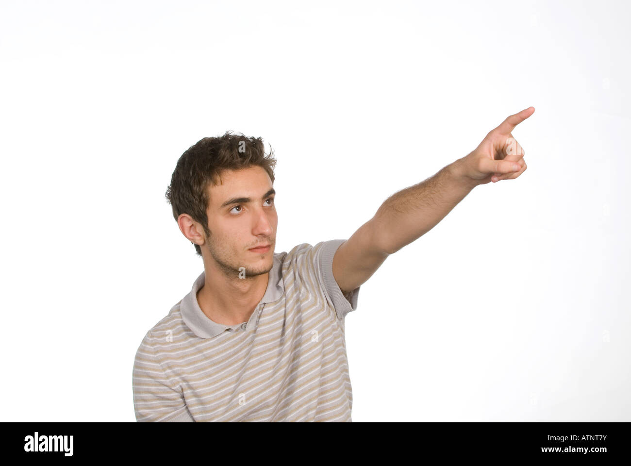 Young man pointing up Stock Photo - Alamy