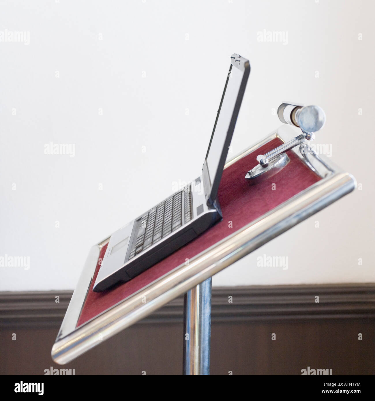 Close-up of an open laptop on a lectern Stock Photo - Alamy