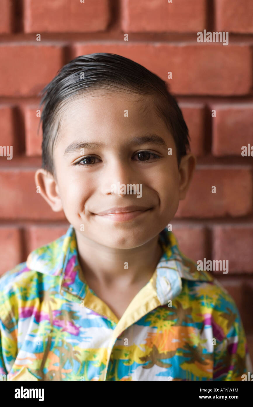 Portrait of a boy smirking Stock Photo - Alamy