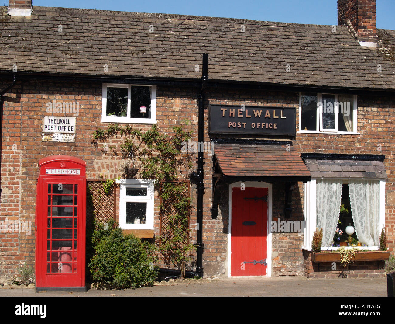 red phone booth post box office terraced cottages Stock Photo - Alamy