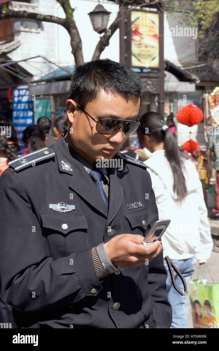 China, Chinese Policeman Making A Phone Call, Dali Old Town, Yunnan ...