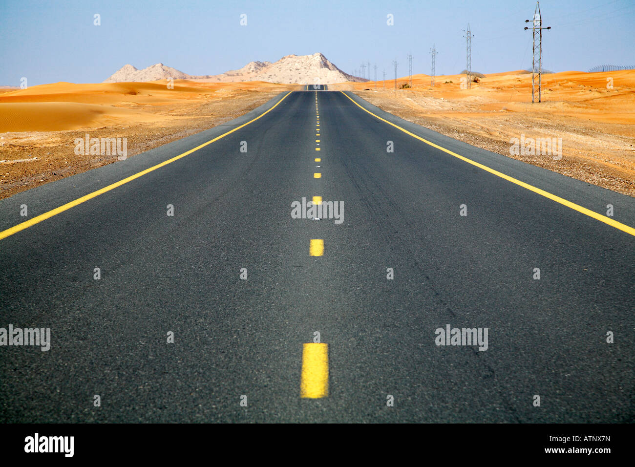 Endless desert road- Dubai Stock Photo - Alamy
