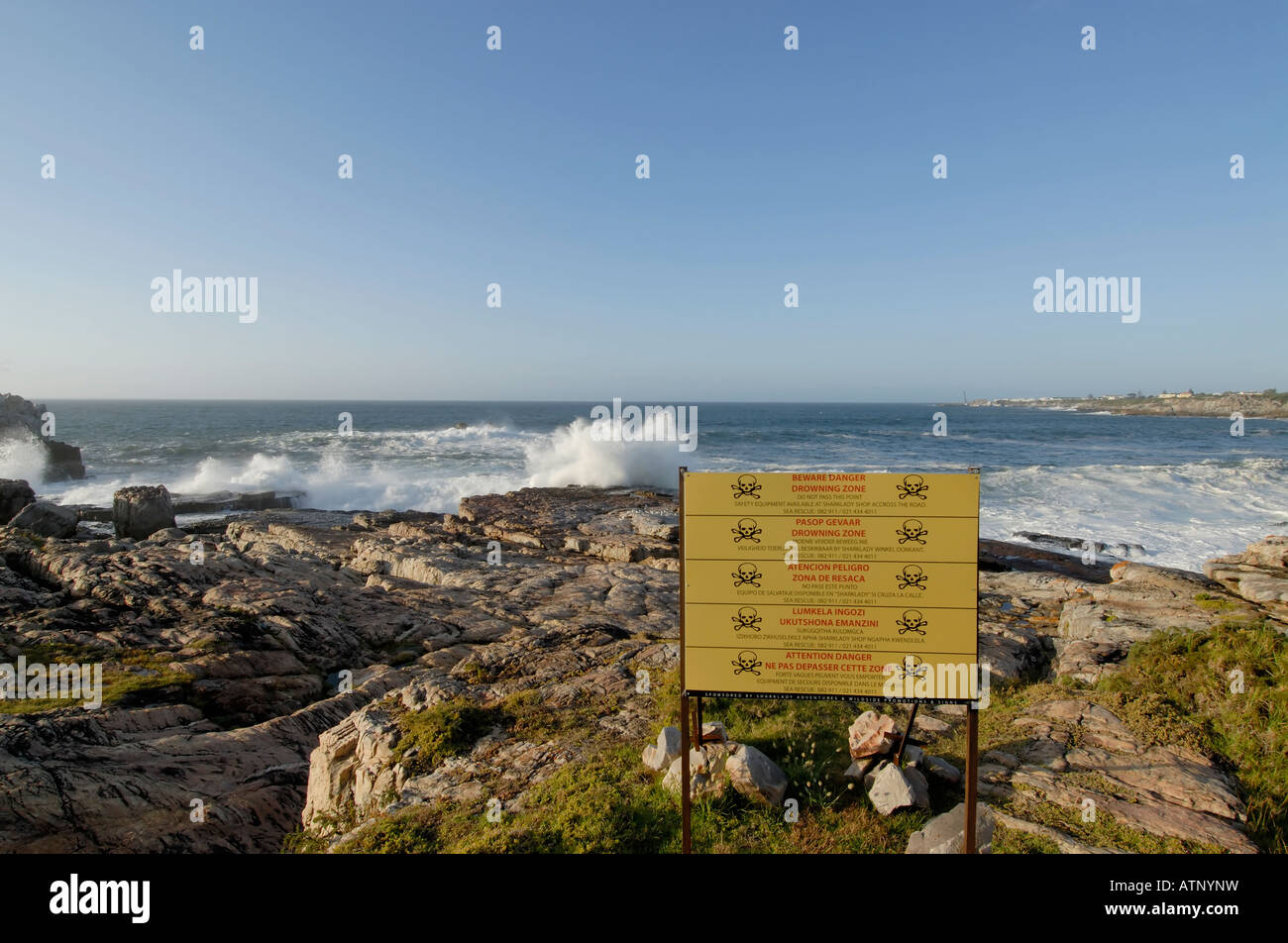 A sign on sea side rocks warning Beware Danger Drowning Zone Do not ...