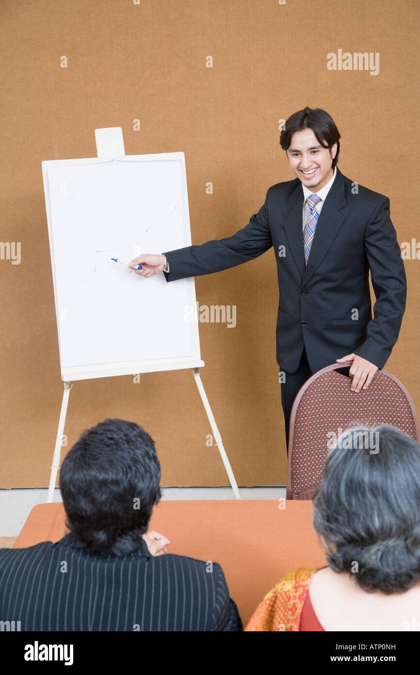 Businessman giving presentation in a meeting Stock Photo - Alamy