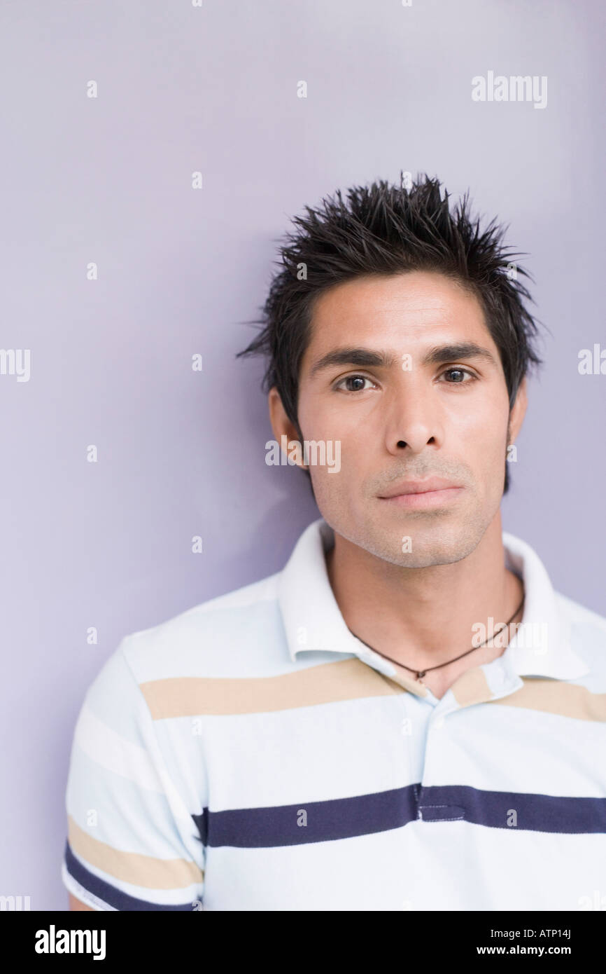 Portrait of a young man looking serious Stock Photo - Alamy