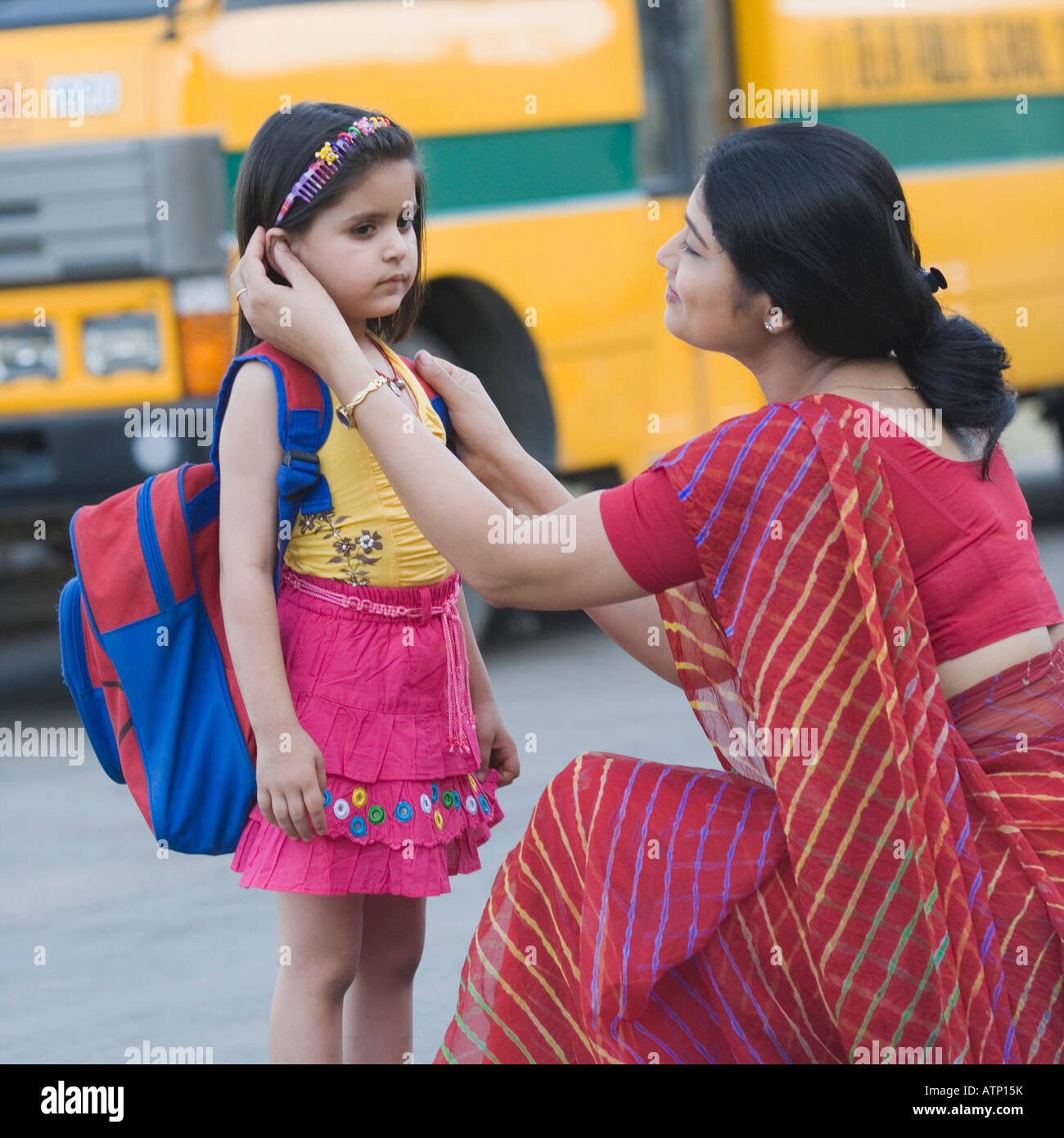 Side profile of a teacher talking to a schoolgirl Stock Photo - Alamy
