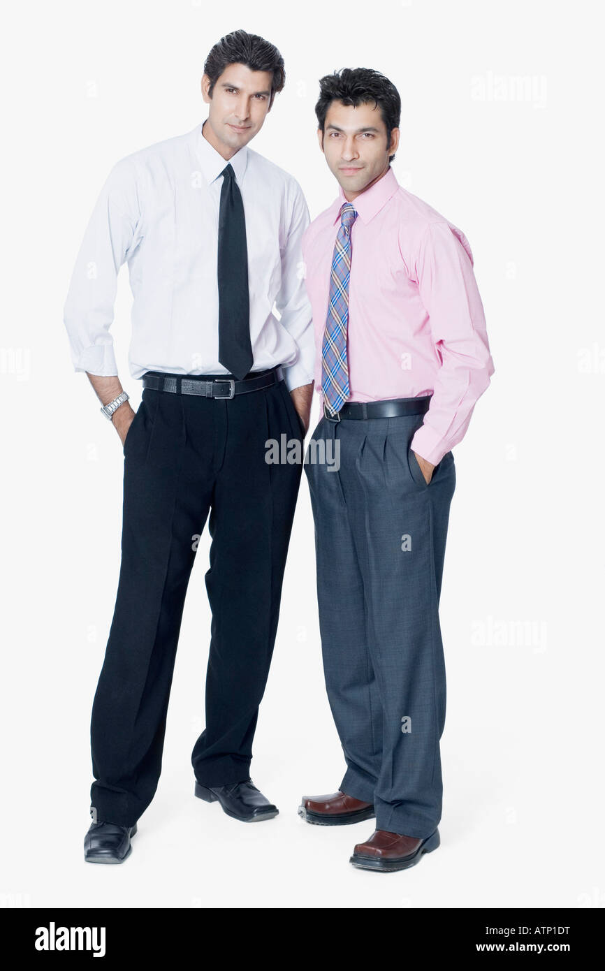 Portrait of two businessmen standing together and smiling Stock Photo ...