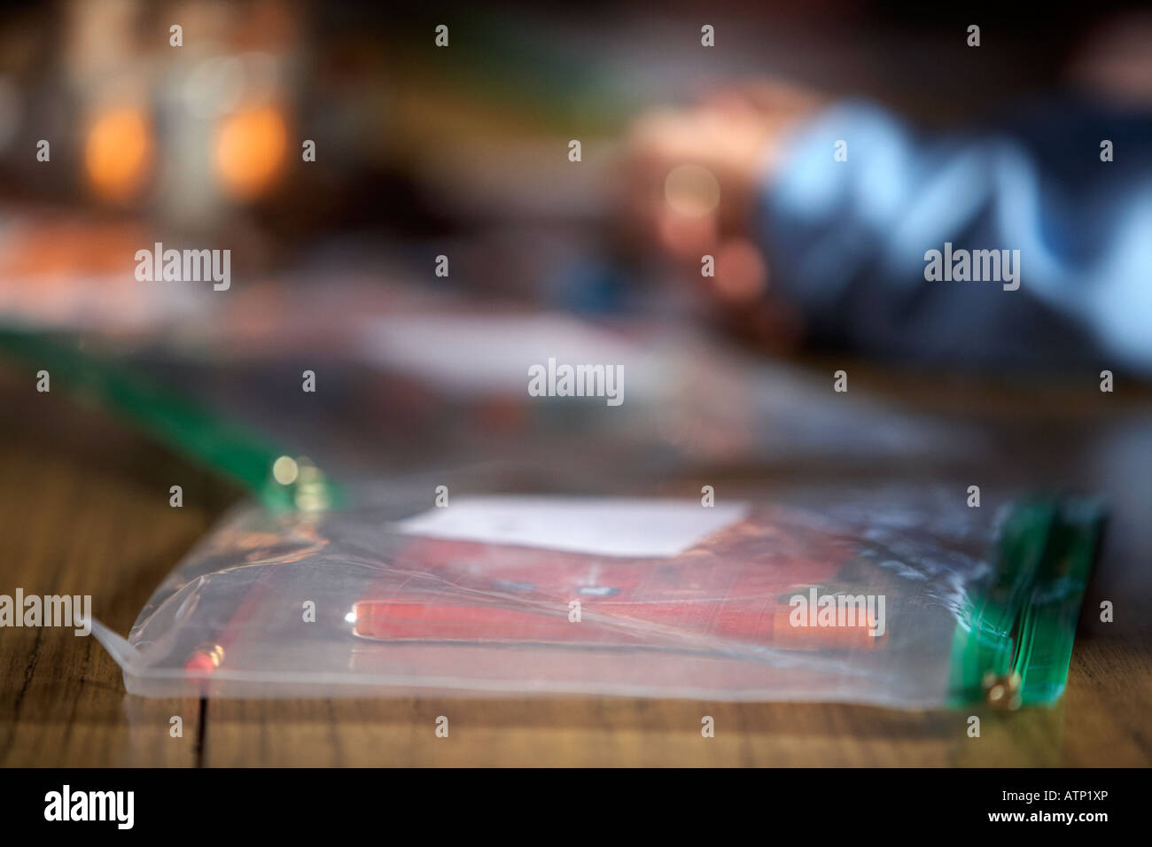 plastic wallet containing schoolwork sitting on a desk in a classroom ...