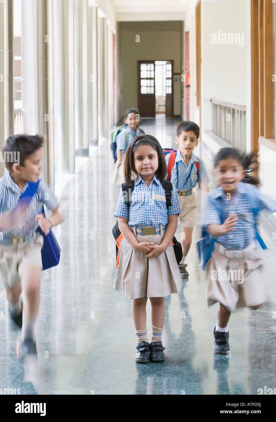 Students running in a corridor Stock Photo - Alamy