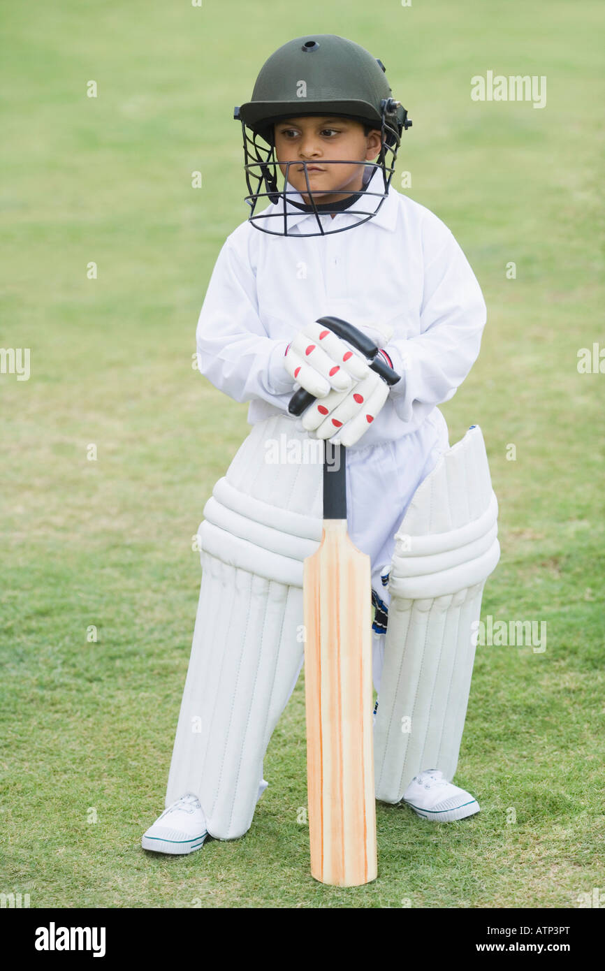 Boy with cricket bat hi-res stock photography and images - Alamy