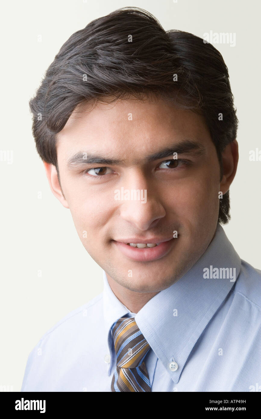 Portrait of a businessman smirking Stock Photo - Alamy