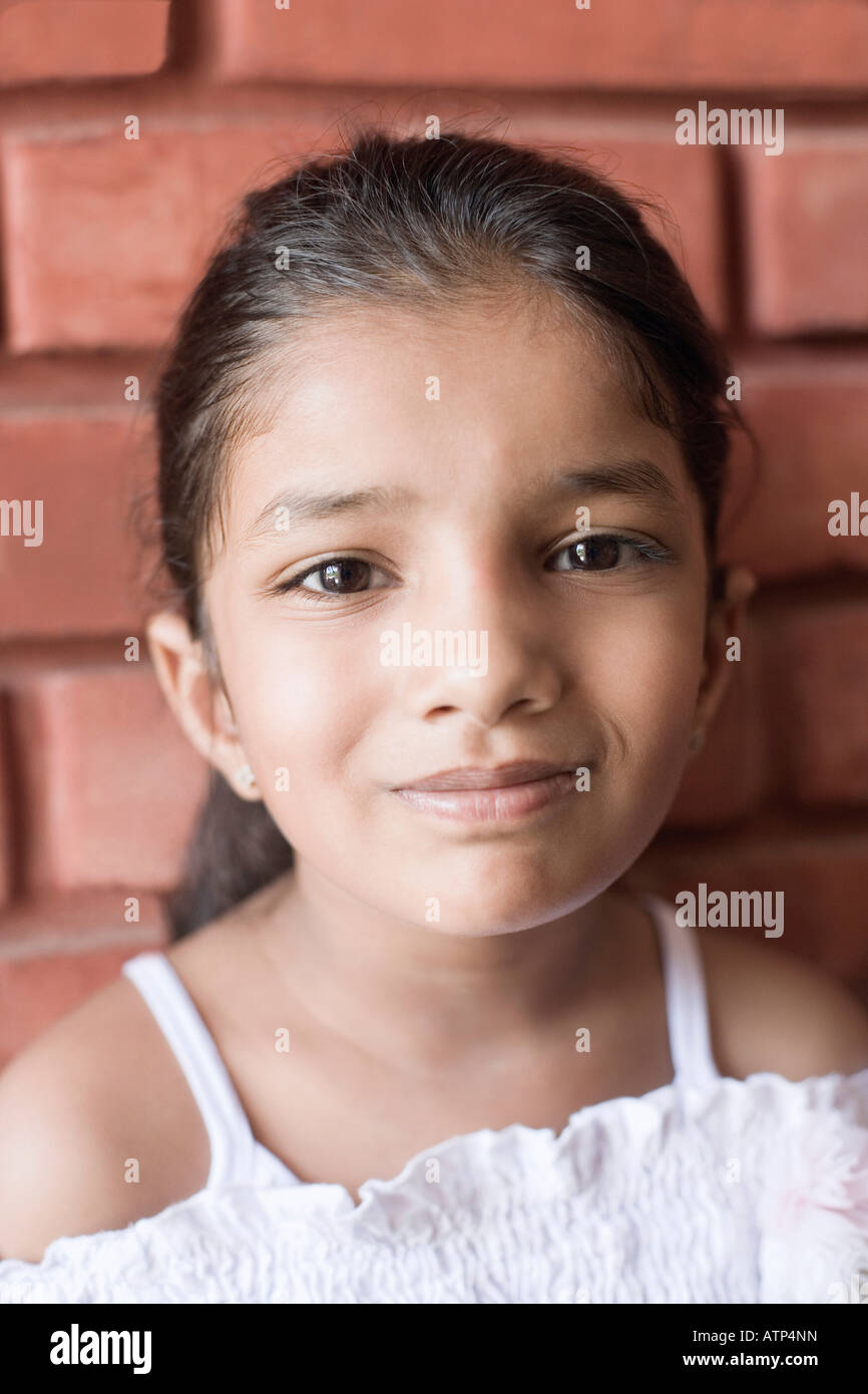 Portrait of a girl smirking Stock Photo - Alamy