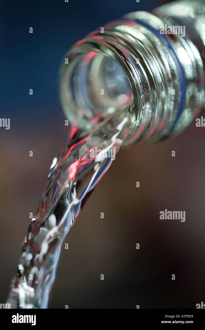 Water being poured out of a bottle Stock Photo - Alamy