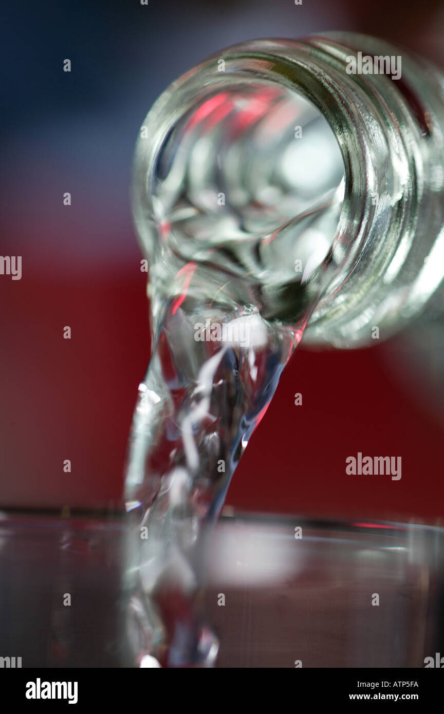 Water being poured out of a bottle Stock Photo - Alamy