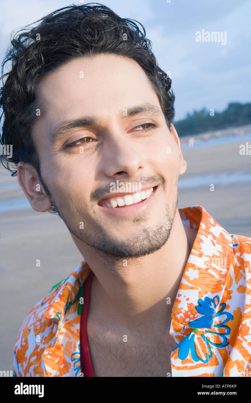 Close-up of a young man smiling Stock Photo - Alamy