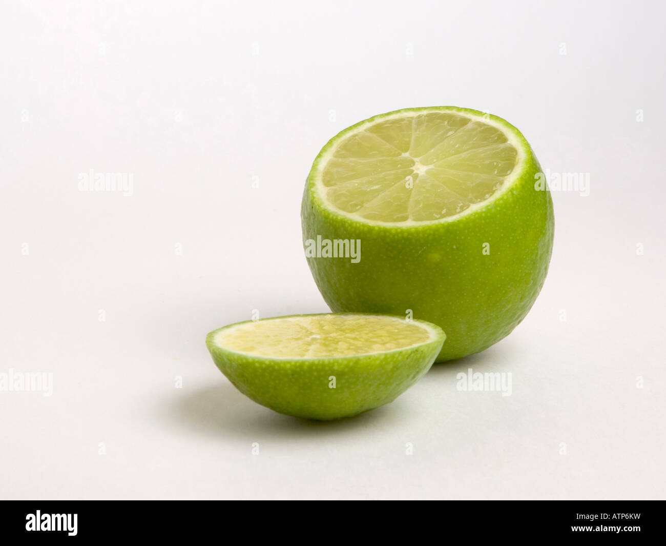 lime cutted into two pieces Stock Photo - Alamy