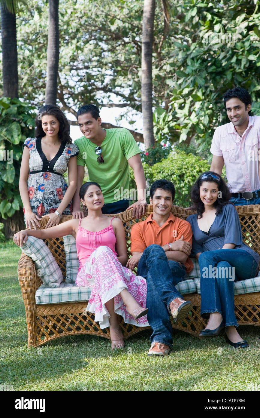 Three young couples in a lawn Stock Photo - Alamy