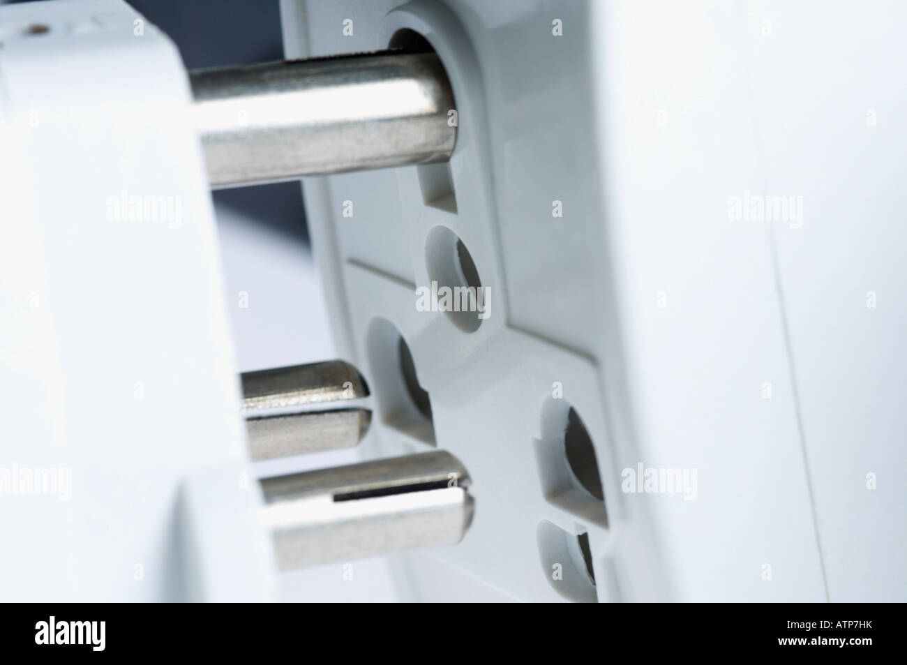 Close-up of a three pin plug with an electric socket Stock Photo - Alamy