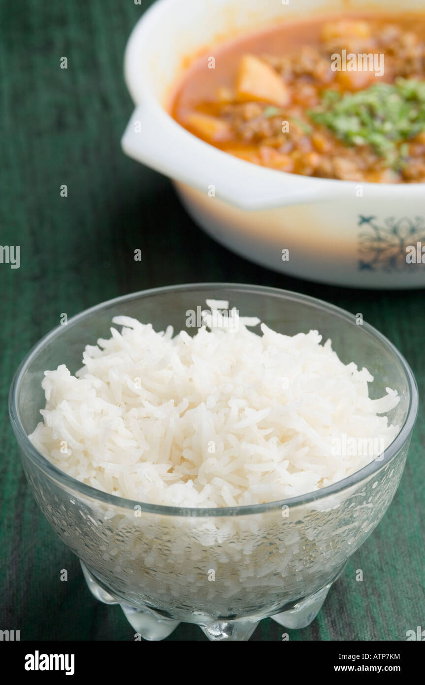 Close-up of a bowl of white rice and a bowl of curry Stock Photo - Alamy