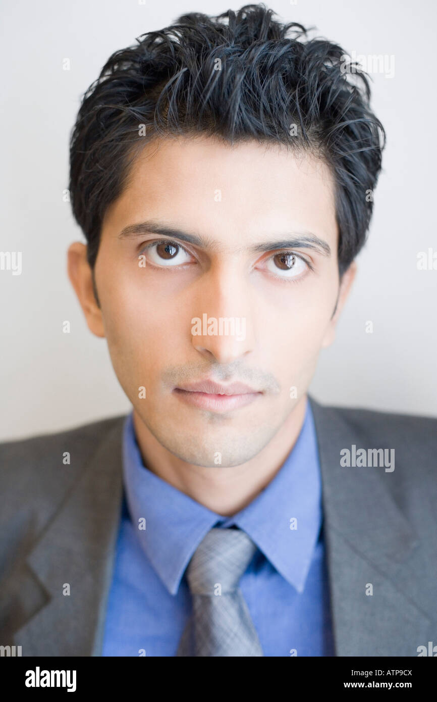 Portrait of a businessman looking serious Stock Photo - Alamy