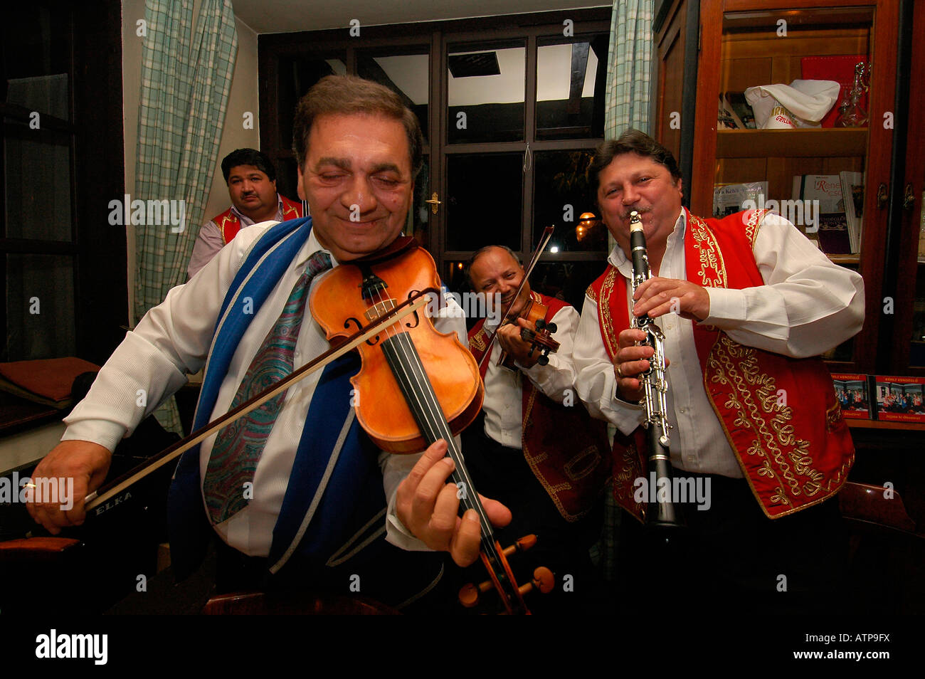 Members of the Romani people (Gypsy) play for guests the Csardas or ...