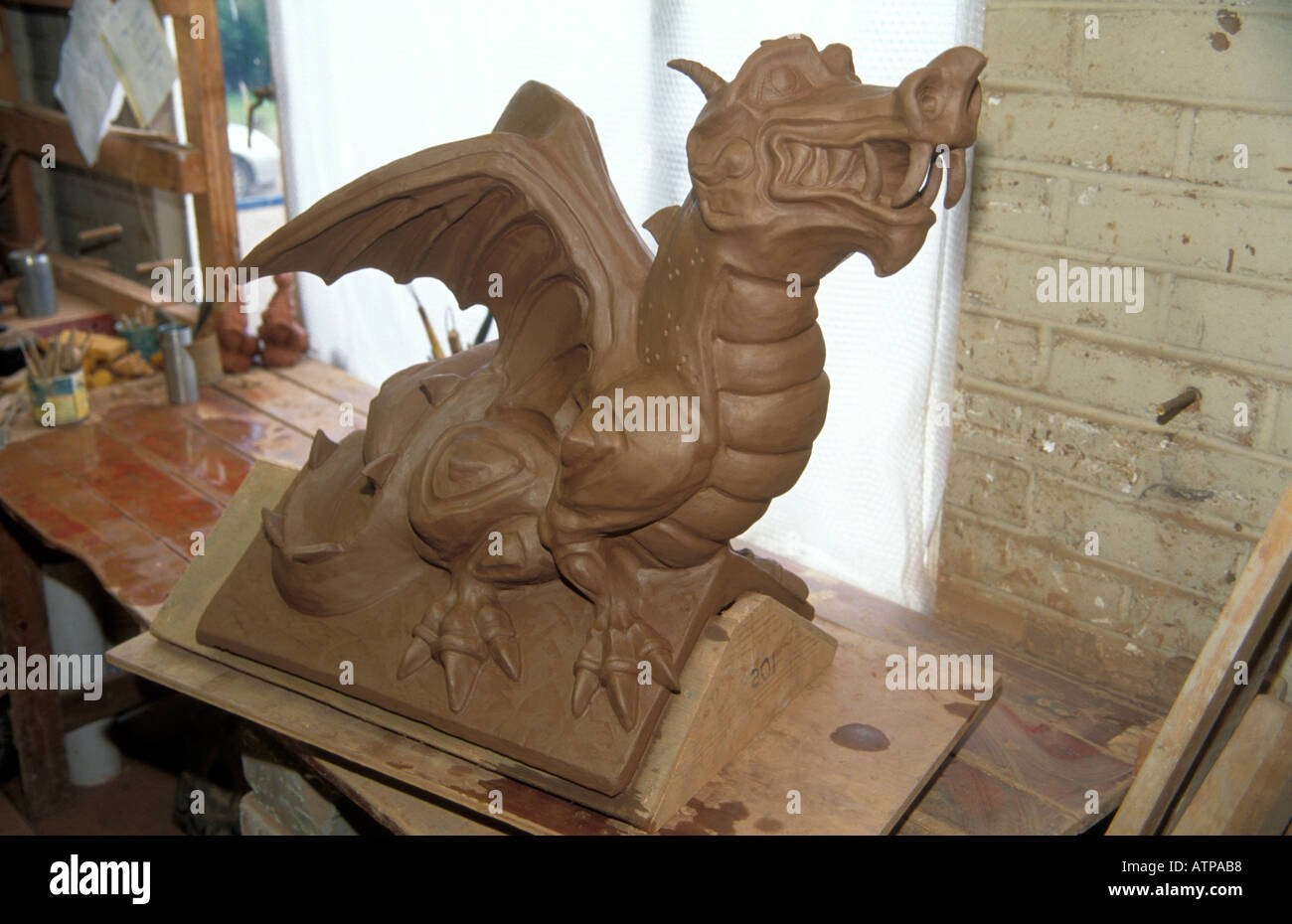 Making a traditional terracootta Welsh roof dragon from clay by hand ...