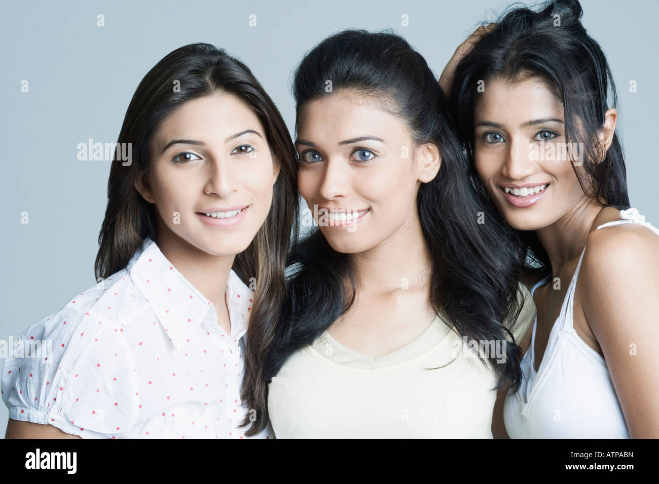 Portrait of three young women smiling Stock Photo - Alamy