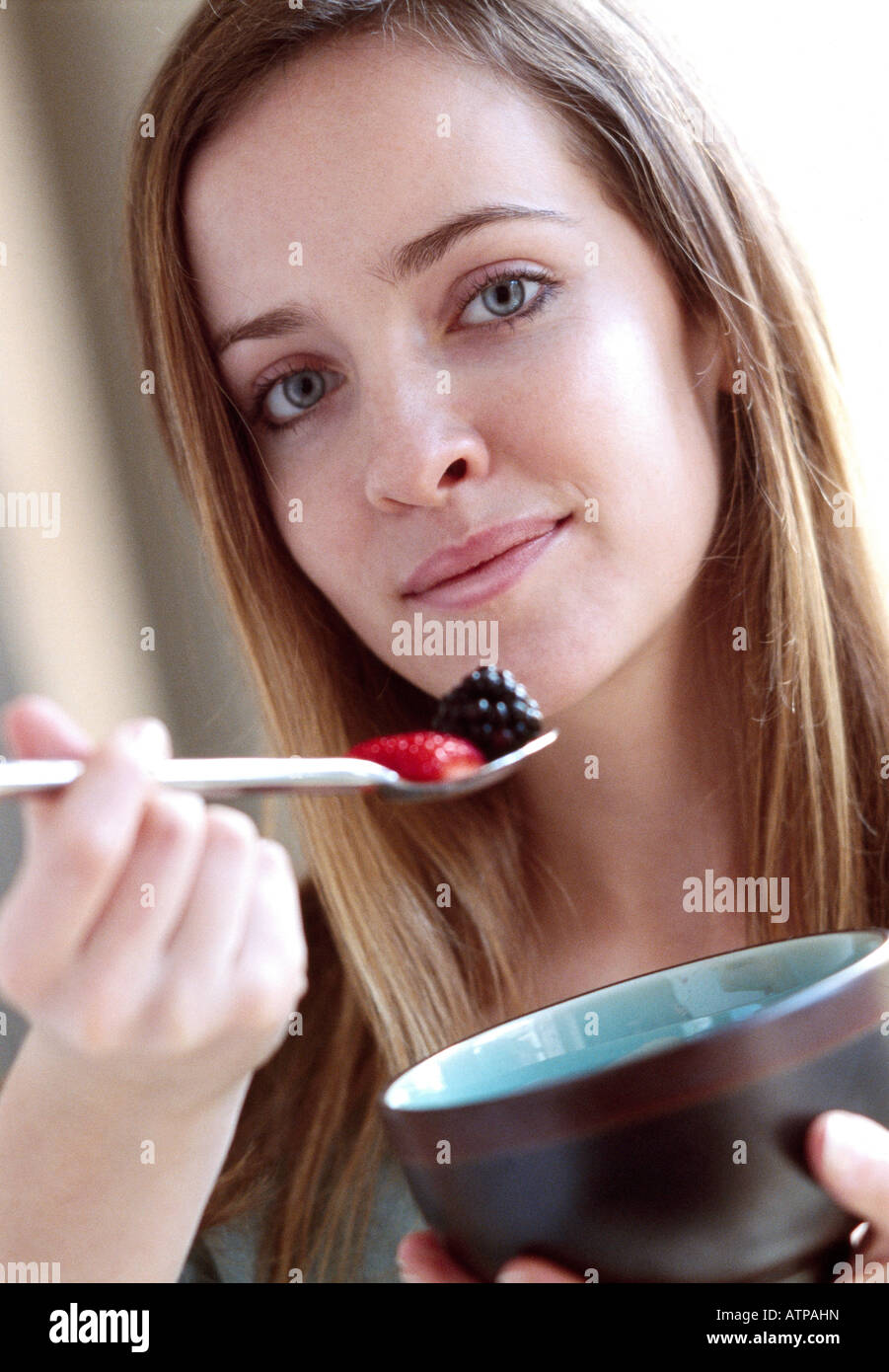 Woman eating berries hi-res stock photography and images - Alamy