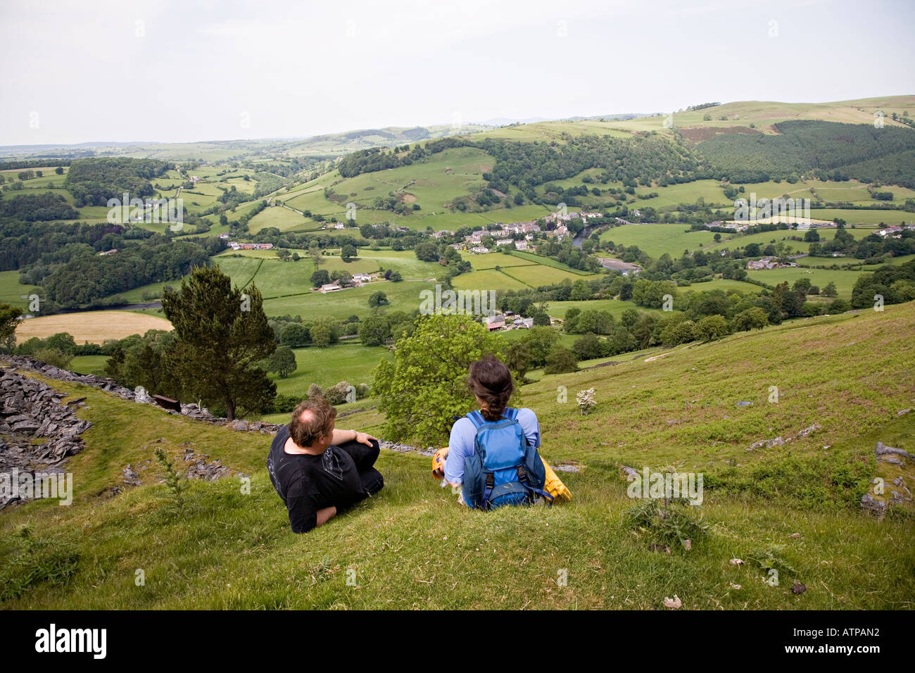 Two walkers enjoying the view of the Dee valley Llangollen Wales UK ...