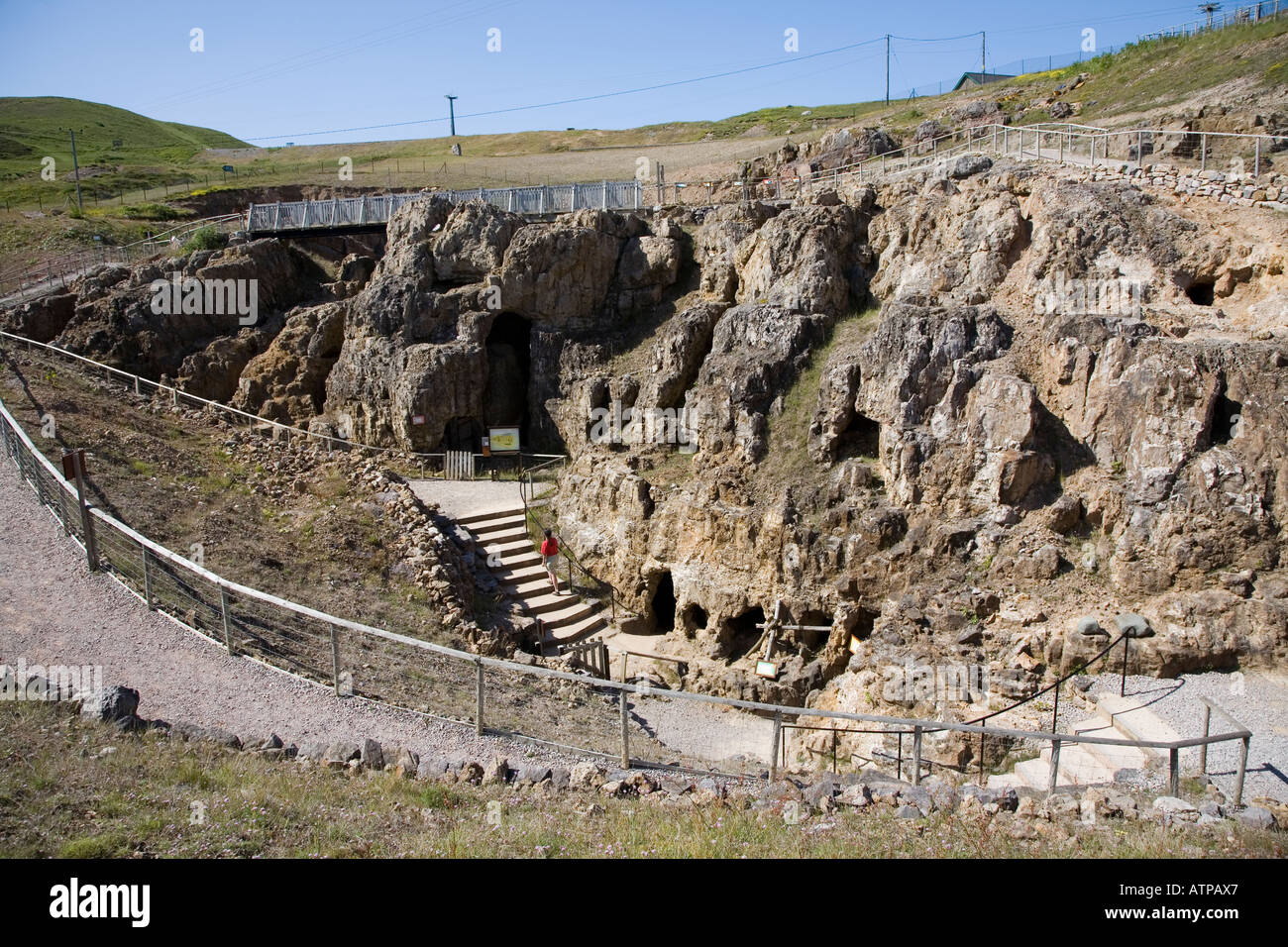 Woman visitor at the Great Orme Ancient Copper Mines excavation ...