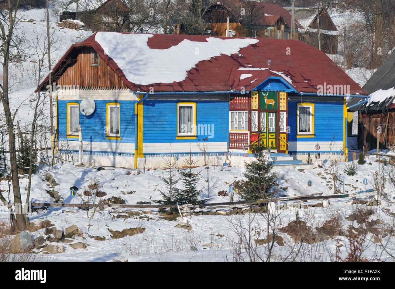 Blue woody house in village Stock Photo - Alamy
