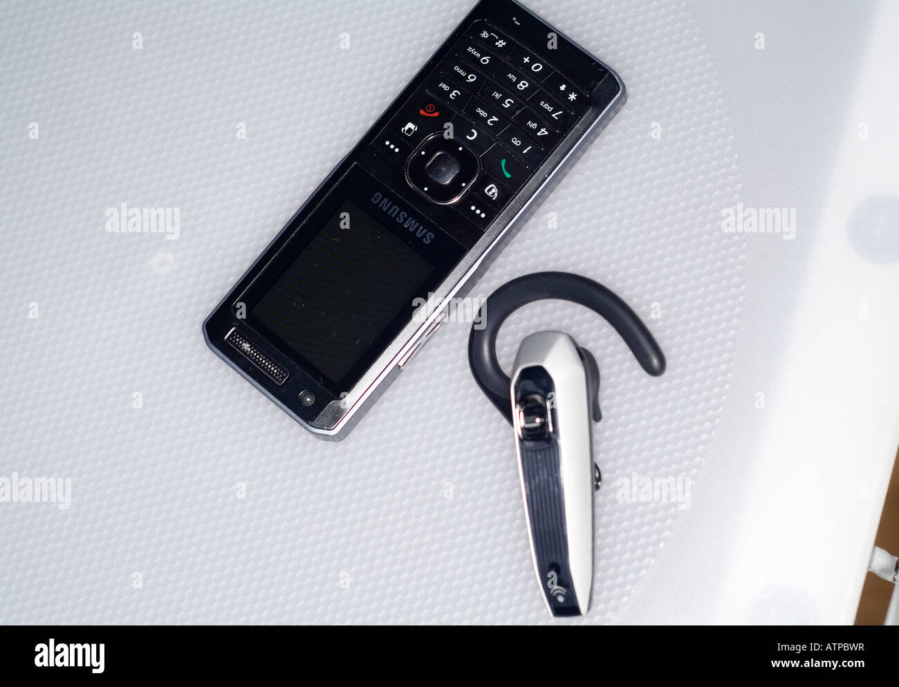 mobile phone and bluetooth device Stock Photo - Alamy
