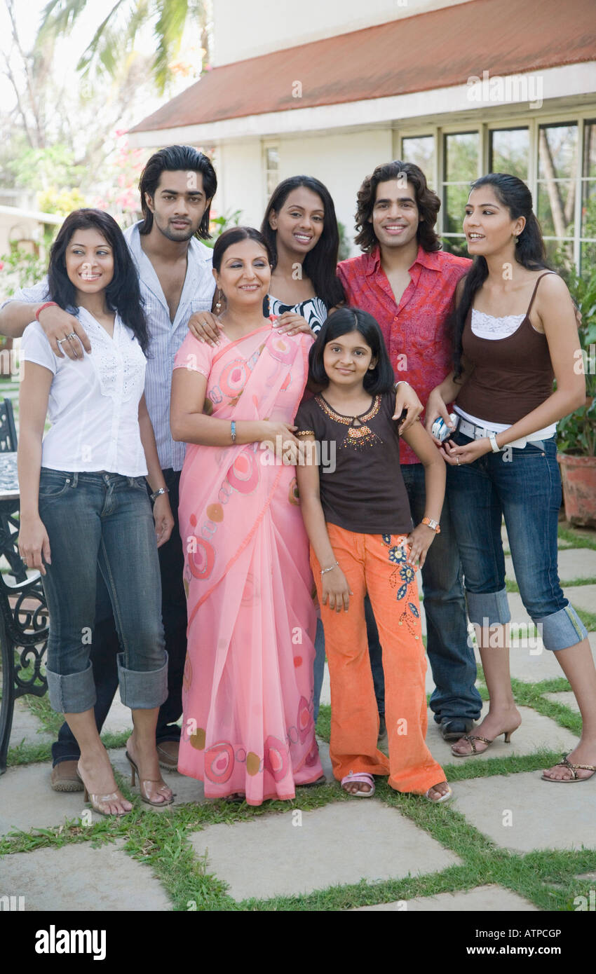 Group of people smiling and standing together Stock Photo - Alamy