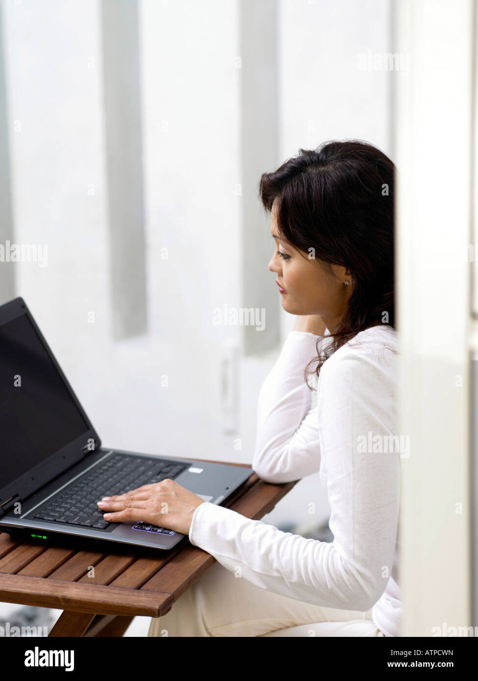 woman using laptop outdoor Stock Photo - Alamy