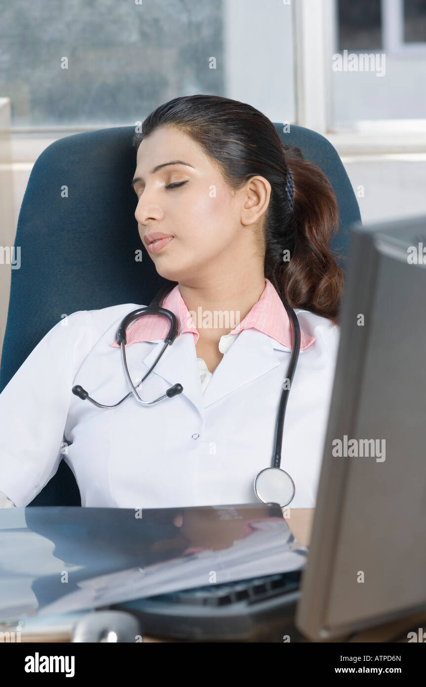 Close-up of a female doctor sleeping Stock Photo - Alamy