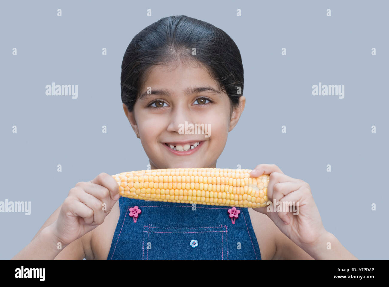 Indian girl eating corn hi-res stock photography and images - Alamy