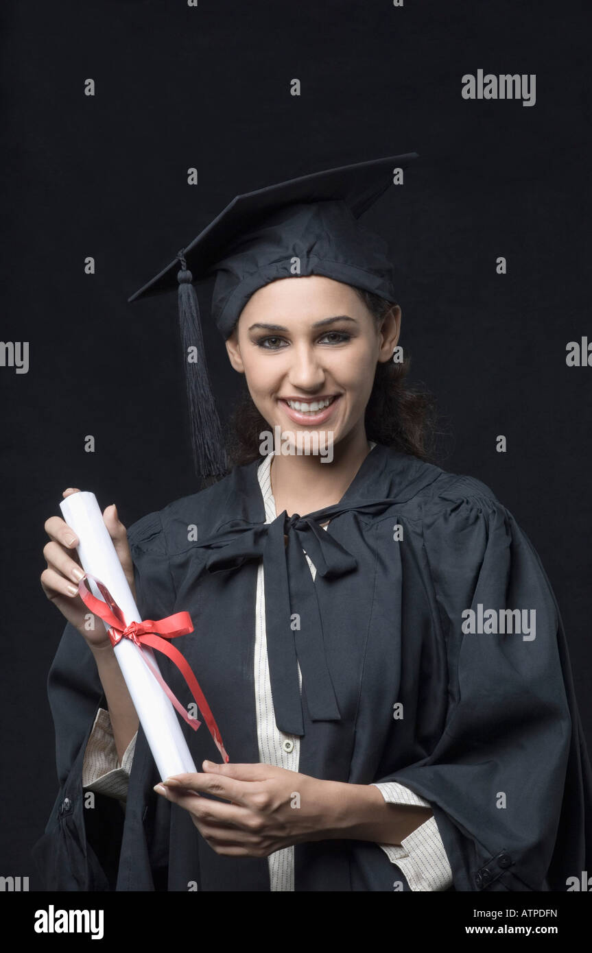 Teen graduate holding diploma hi-res stock photography and images - Alamy