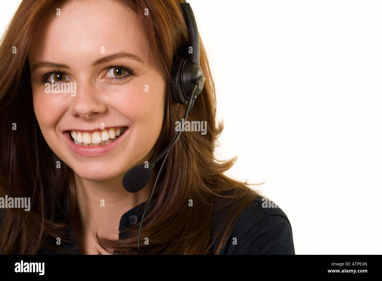 Smiling telephone operator Stock Photo - Alamy