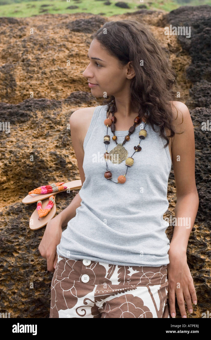 Female leaning against rock hi-res stock photography and images - Alamy