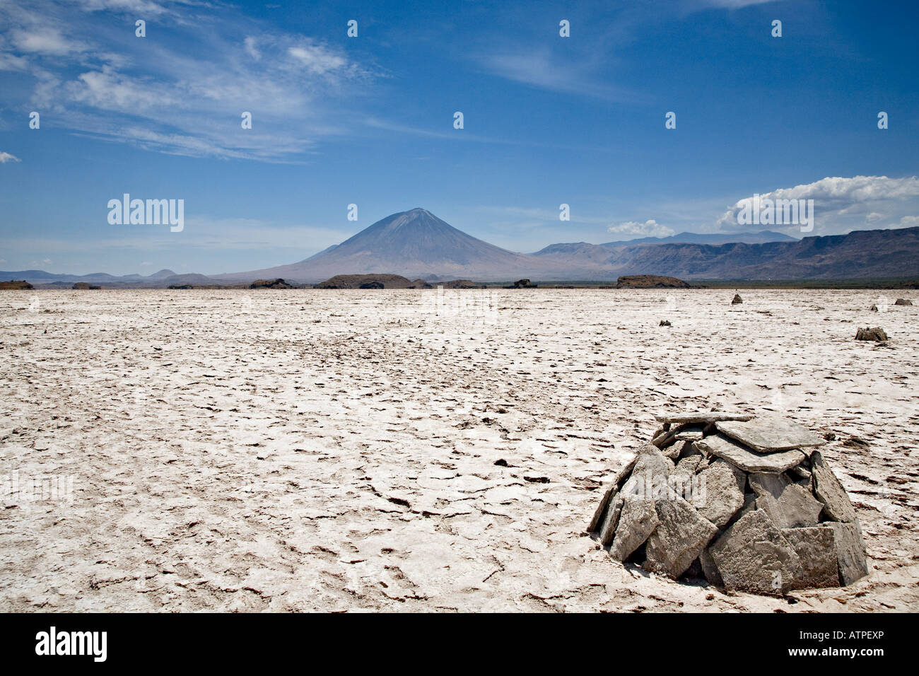 Dried out Lake Natron, Ol' Donyo Lengai volcano visible in a distance ...