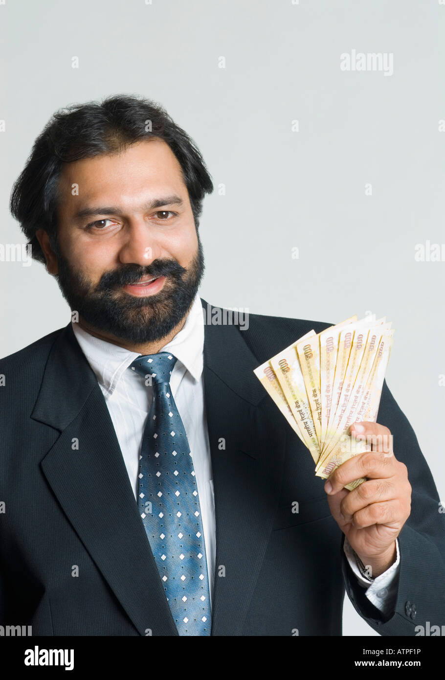 Man holding indian rupee notes hi-res stock photography and images - Alamy