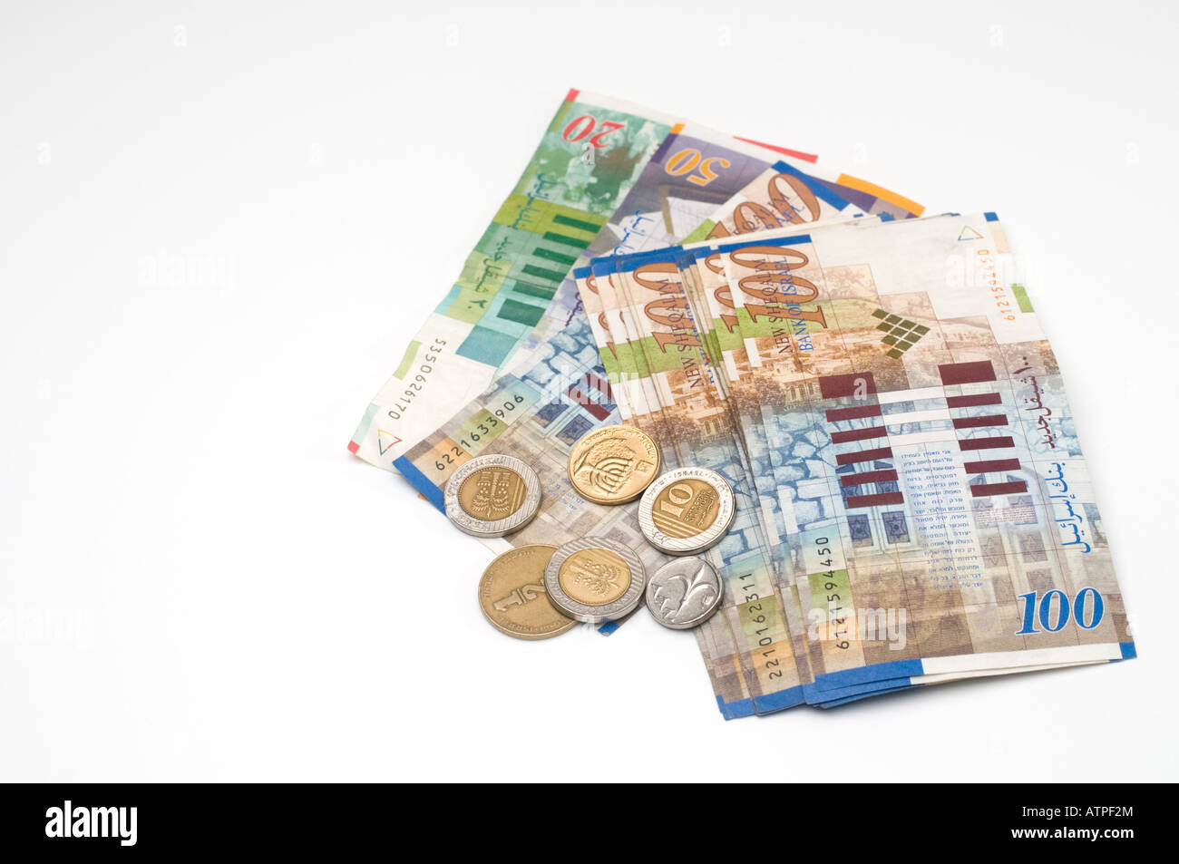 Israeli currency NIS New Israeli Sheqalim notes and coins on white ...