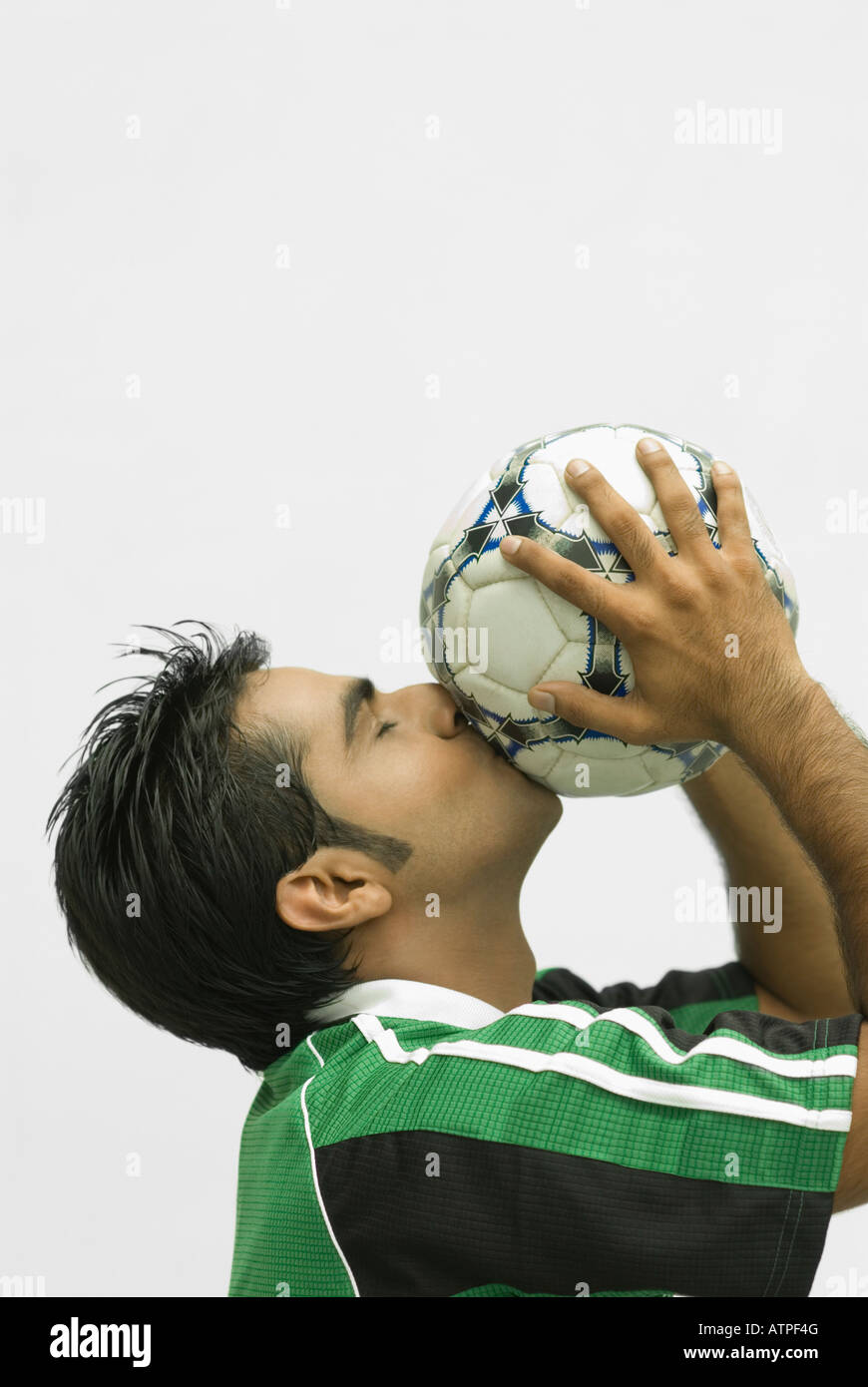 Close-up of a young man kissing a soccer ball Stock Photo - Alamy