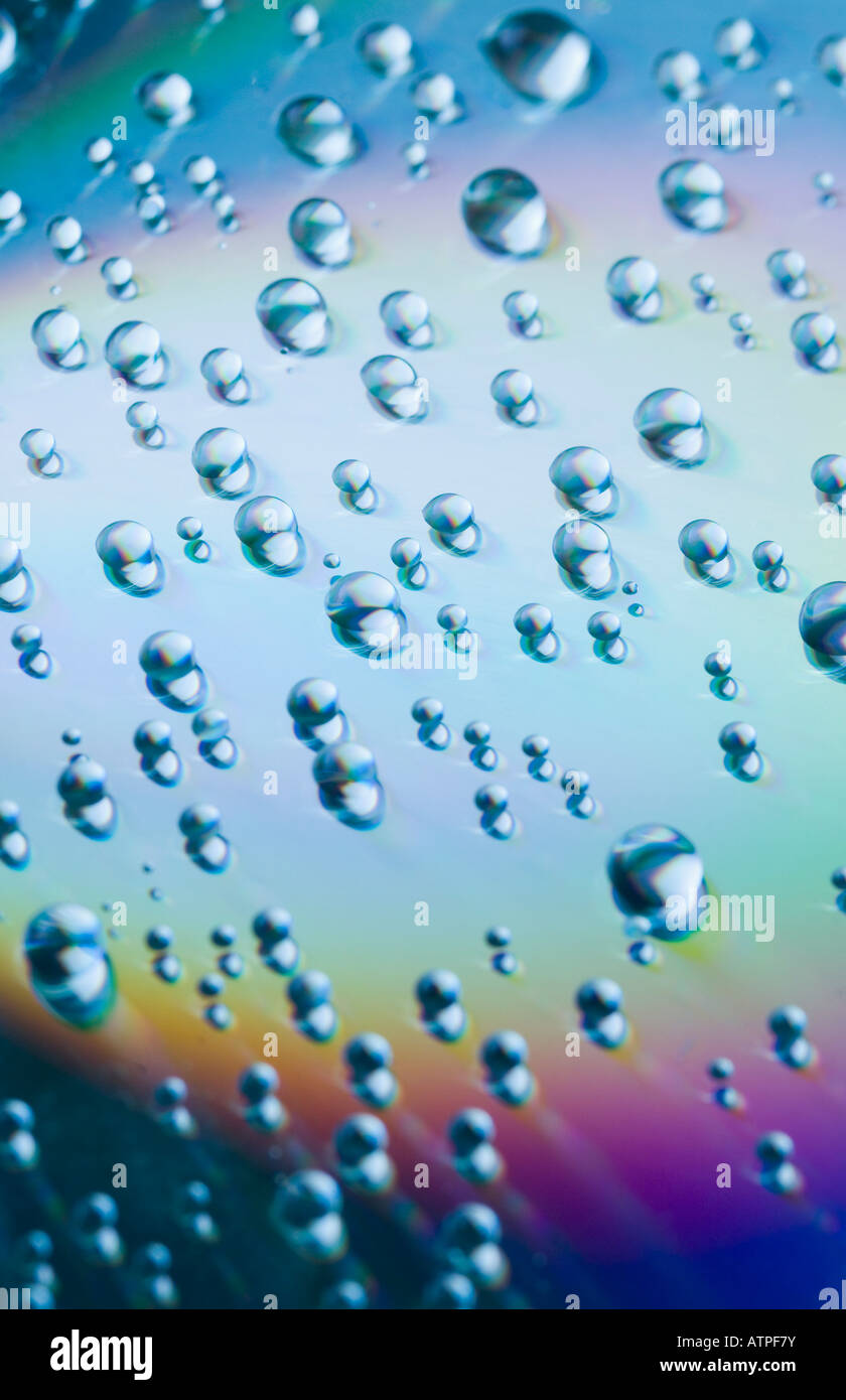 Close-up of water drops on a multi-colored surface Stock Photo - Alamy
