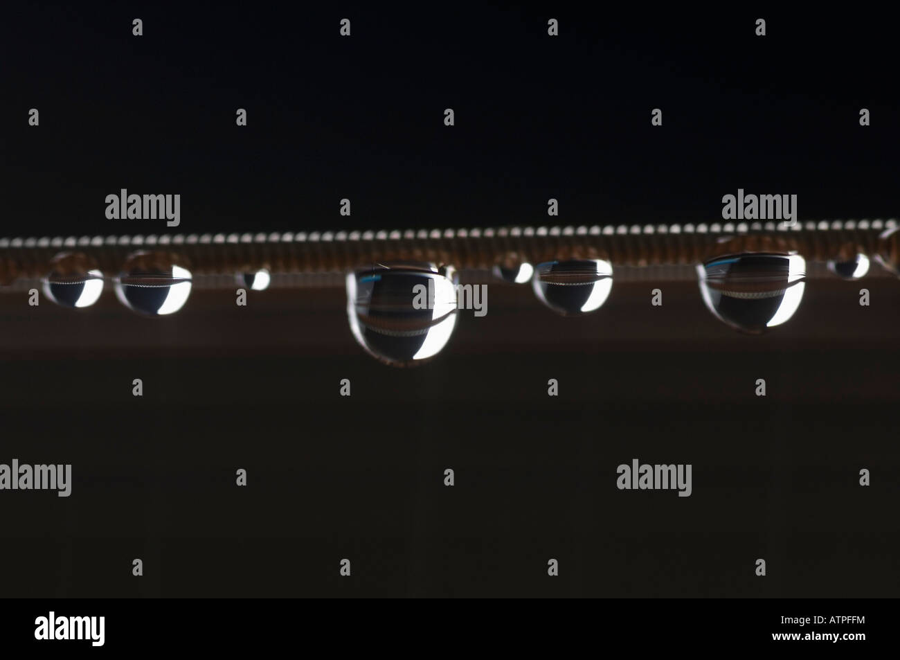 Drops of water on a black metal hi-res stock photography and images - Alamy