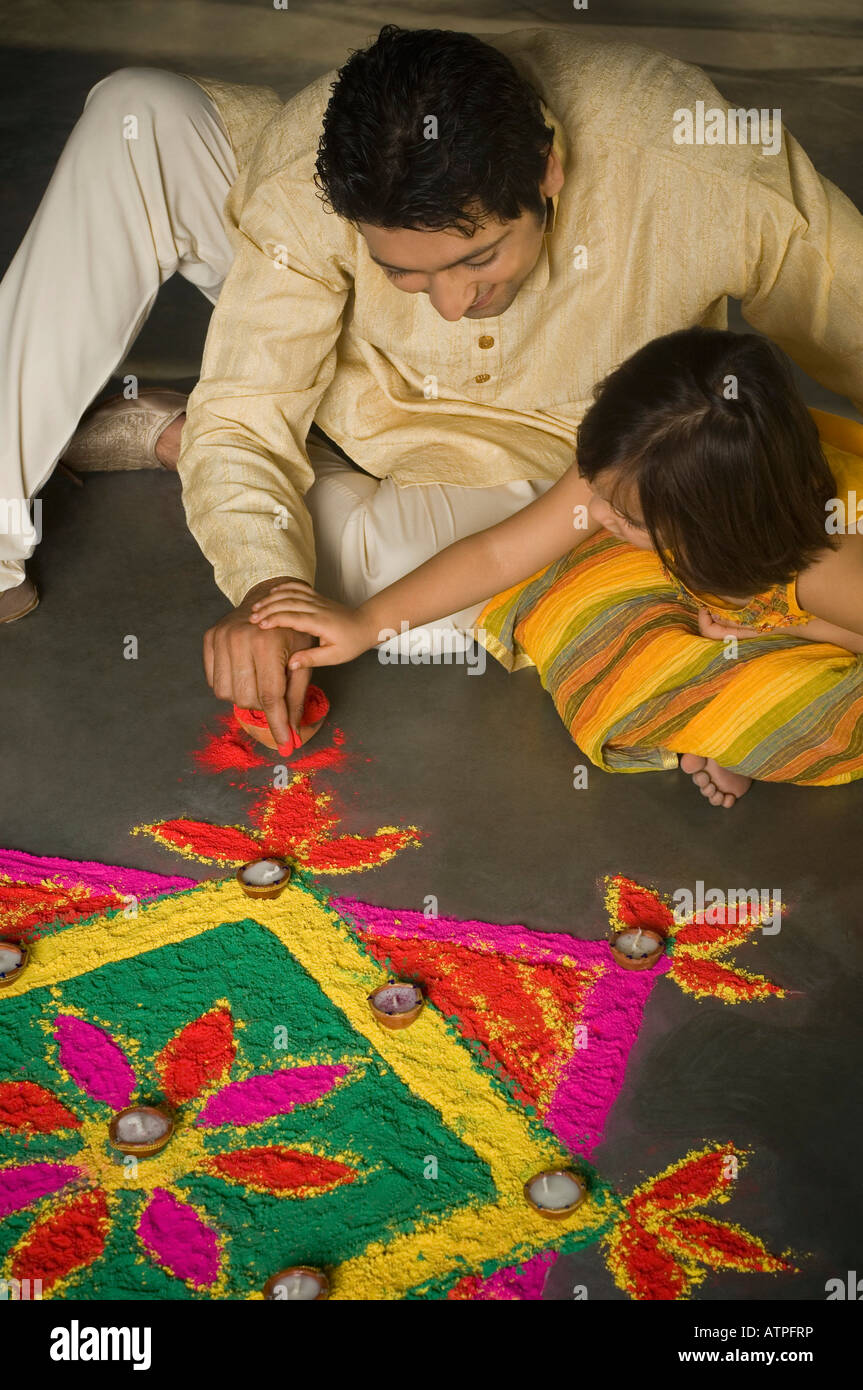 Indian girls making rangoli hi-res stock photography and images - Alamy