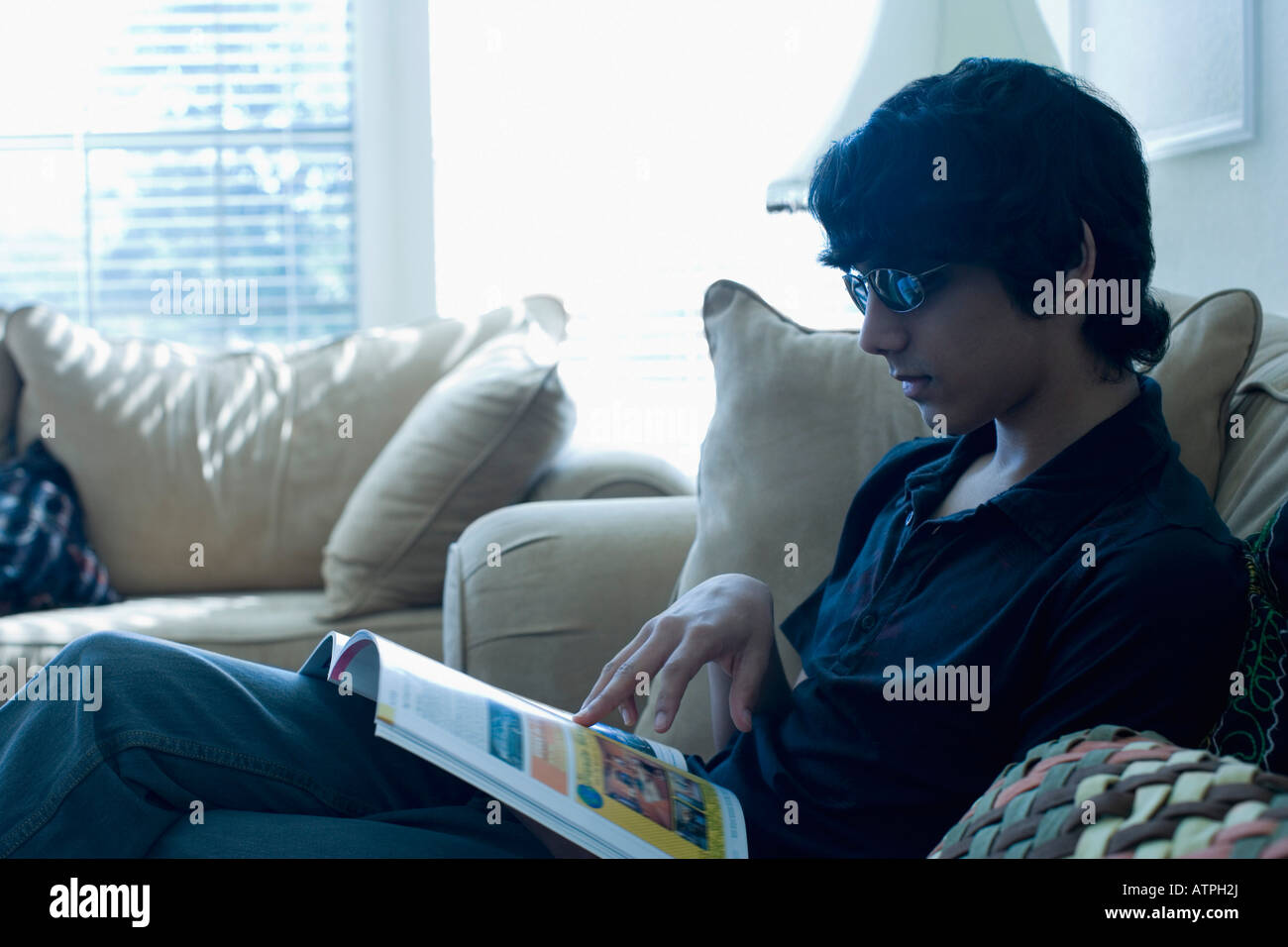 Teen Boy Reading Magazine High Resolution Stock Photography and Images ...