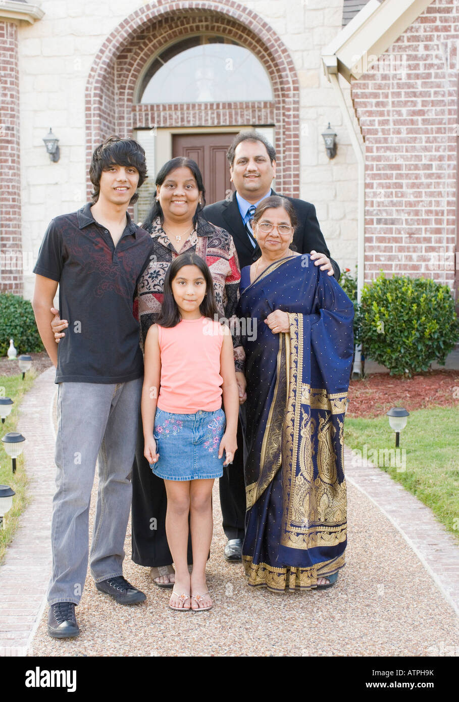Portrait of a family standing together Stock Photo - Alamy